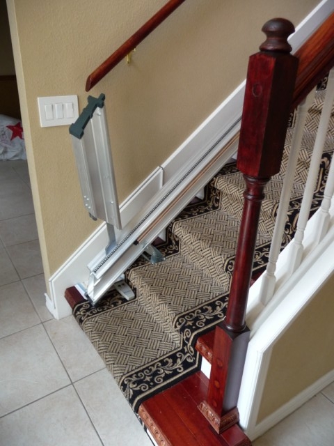 Stairlift folding hinged tracks solve that walkway obstruction issue.